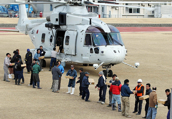 Japan earthquake: Relief efforts begin - in pictures