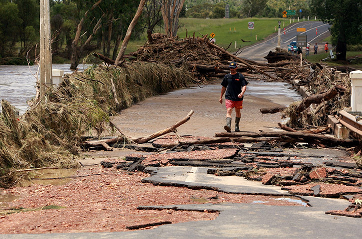 Australians flee Queensland floods - in pictures